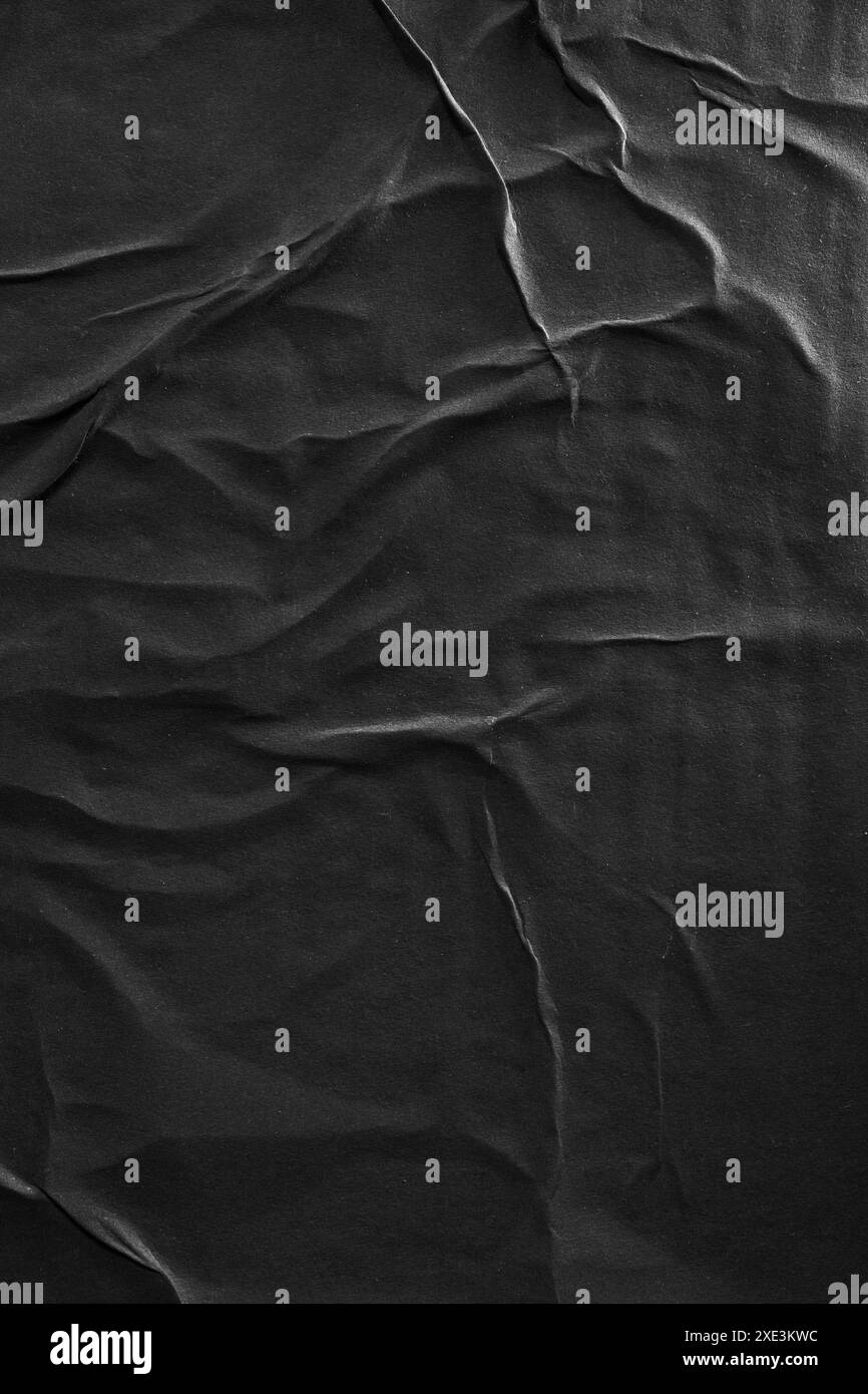 Vertical black crumpled paper poster texture background Stock Photo - Alamy