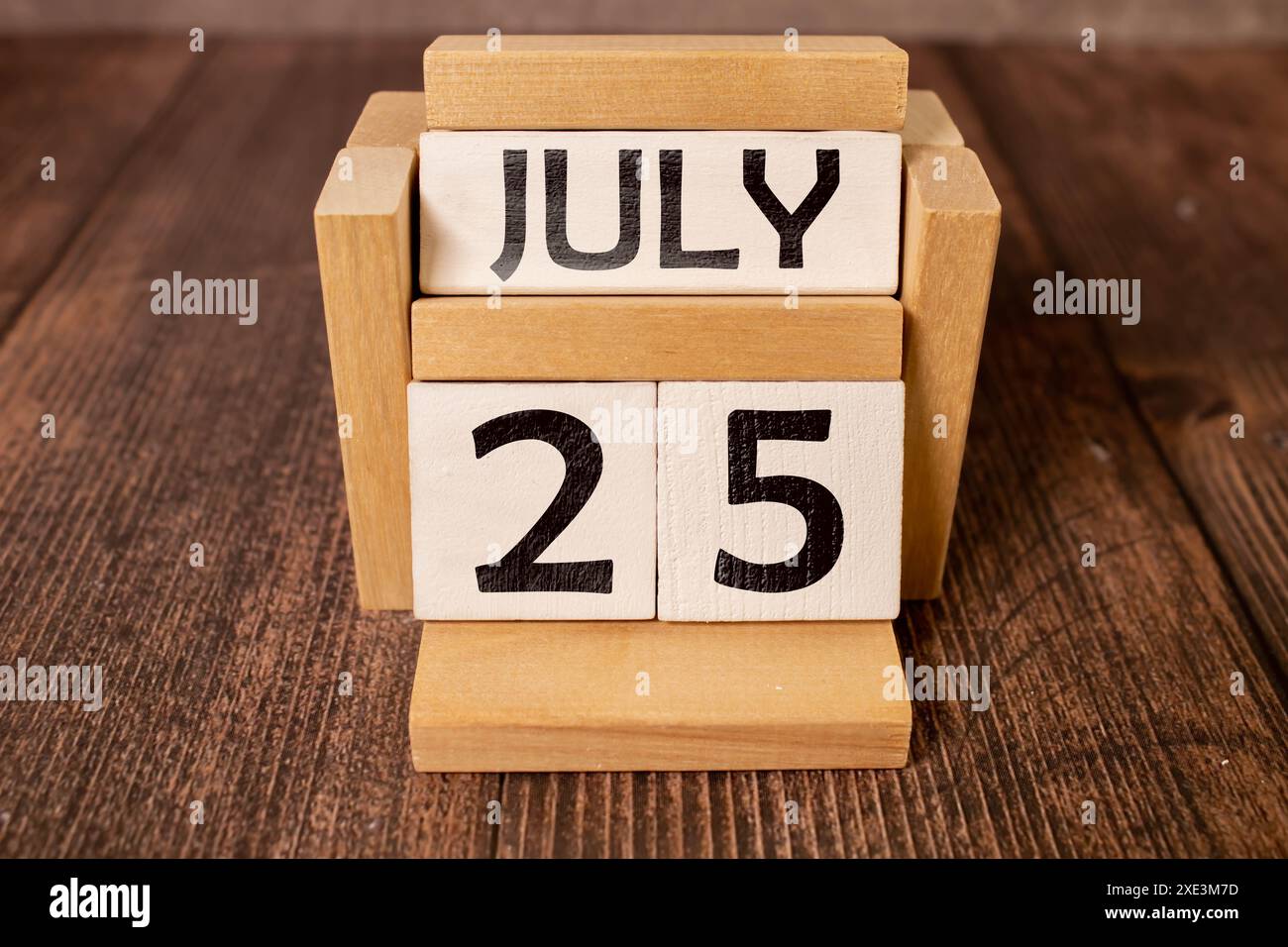 July 25. 25th day of the month, wooden calendar isolated on a white ...