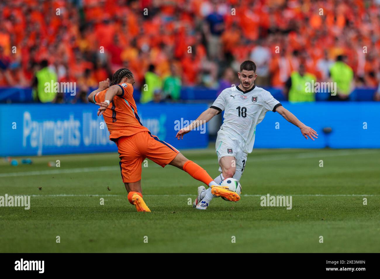 Romano Schmid of Austria and Xavi Simons of Netherlands during UEFA ...