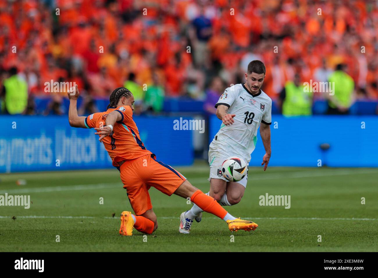 Romano Schmid of Austria and Xavi Simons of Netherlands during UEFA ...