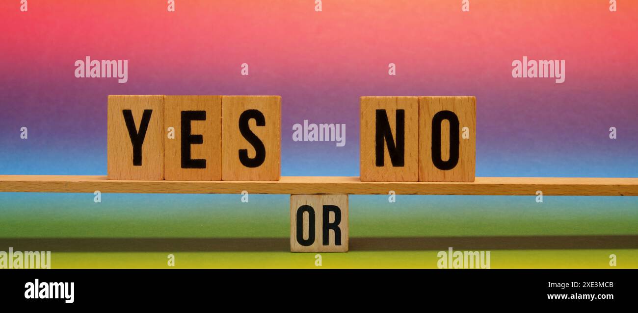 Yes and no in balance - pictured as balanced wooden cubes on scale that ...