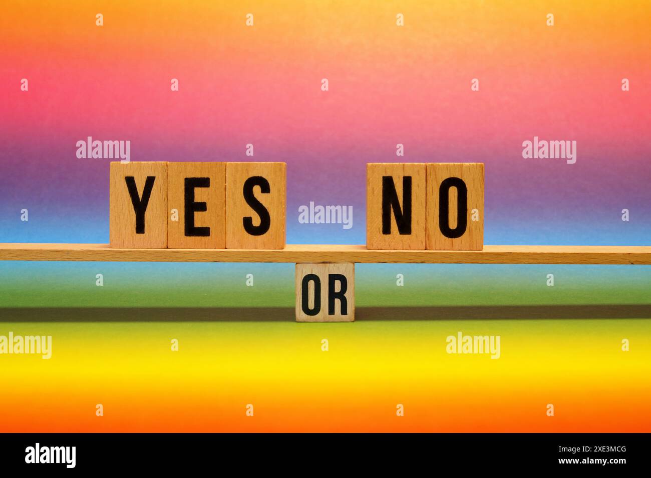 Yes and no in balance - pictured as balanced wooden cubes on scale that ...