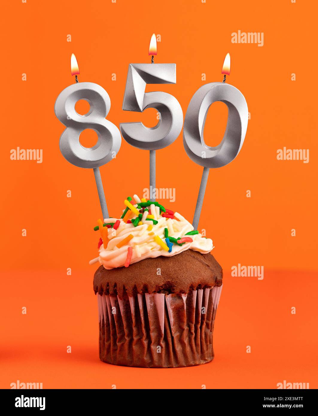 Birthday cupcake with number 850 candle - Orange color background Stock ...