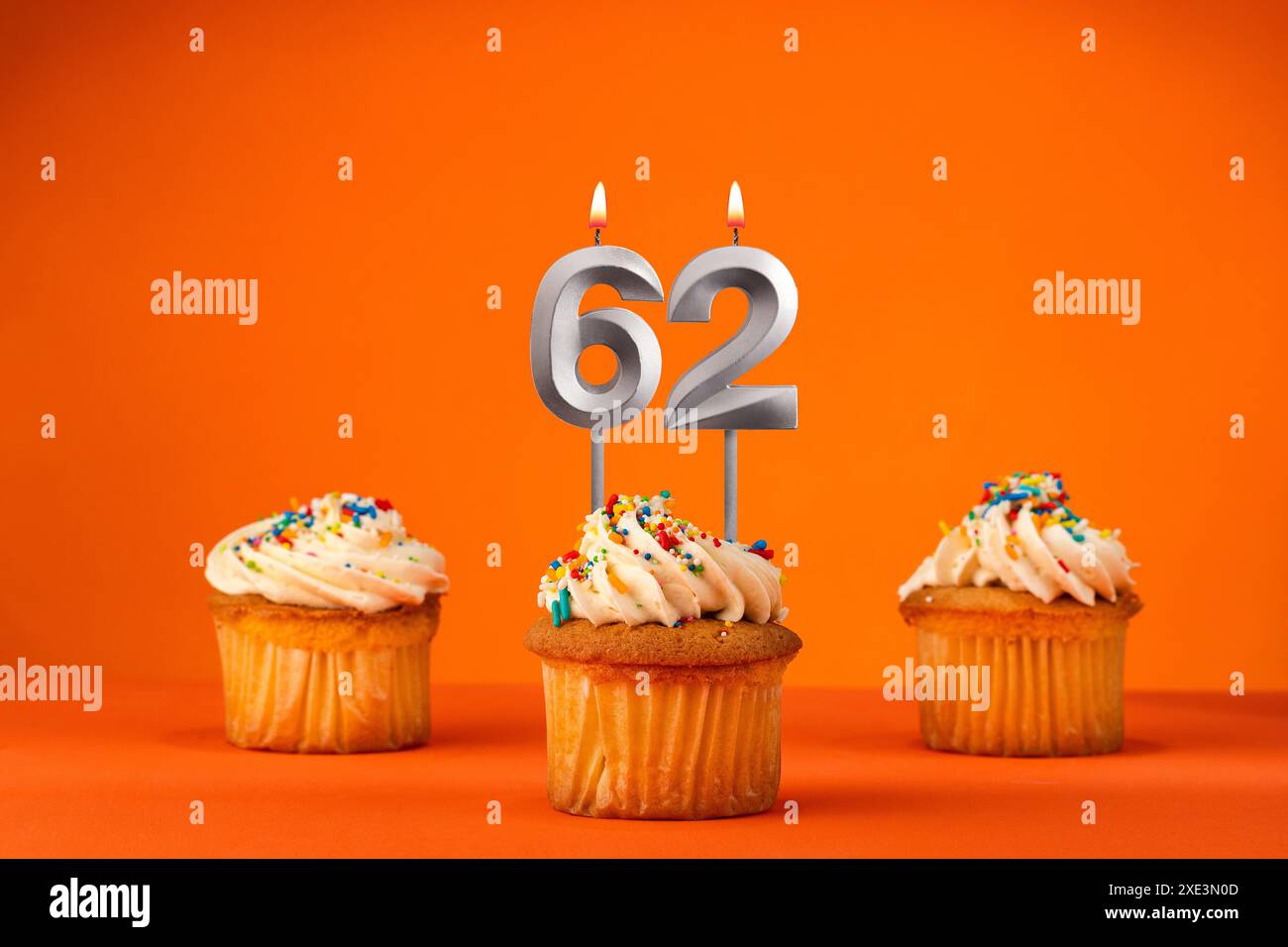Birthday celebration in orange color - Candle number 62 Stock Photo - Alamy