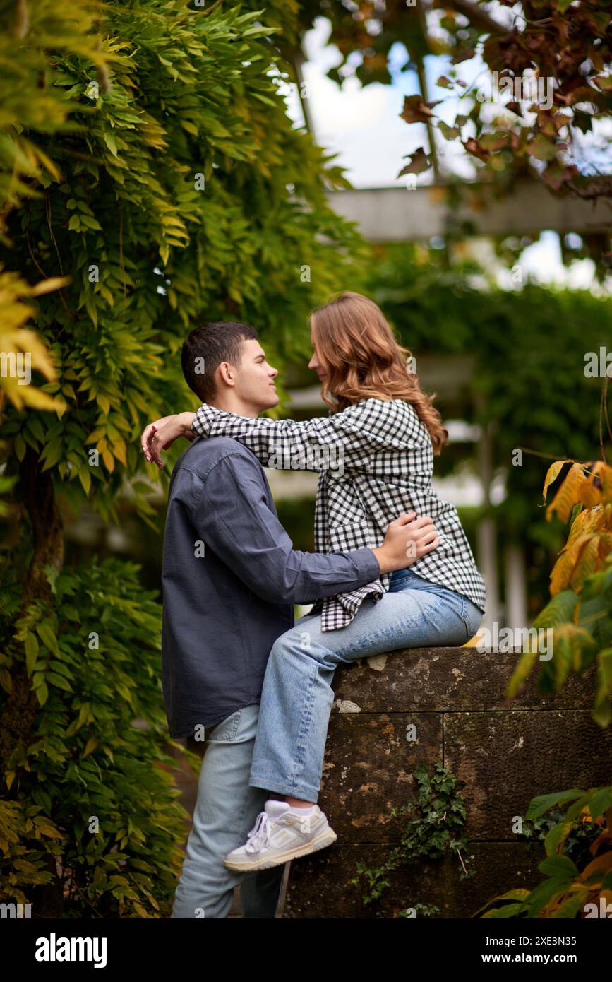 Young Cute Female Hugs Boyfriend. In Autumn Outdoor. Lovers Walking in ...