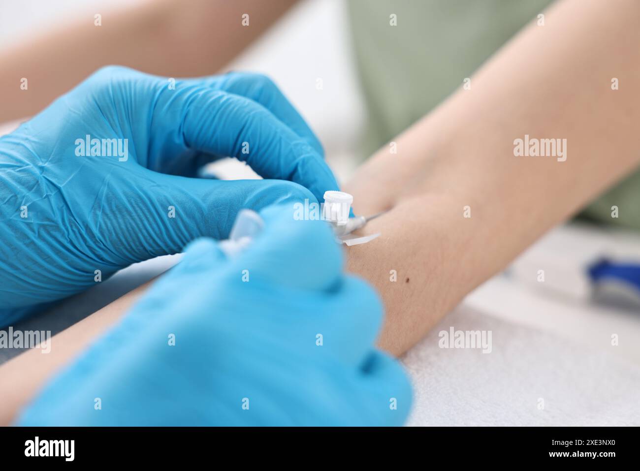 Nurse inputting catheter for IV drip in patient hand, closeup Stock ...