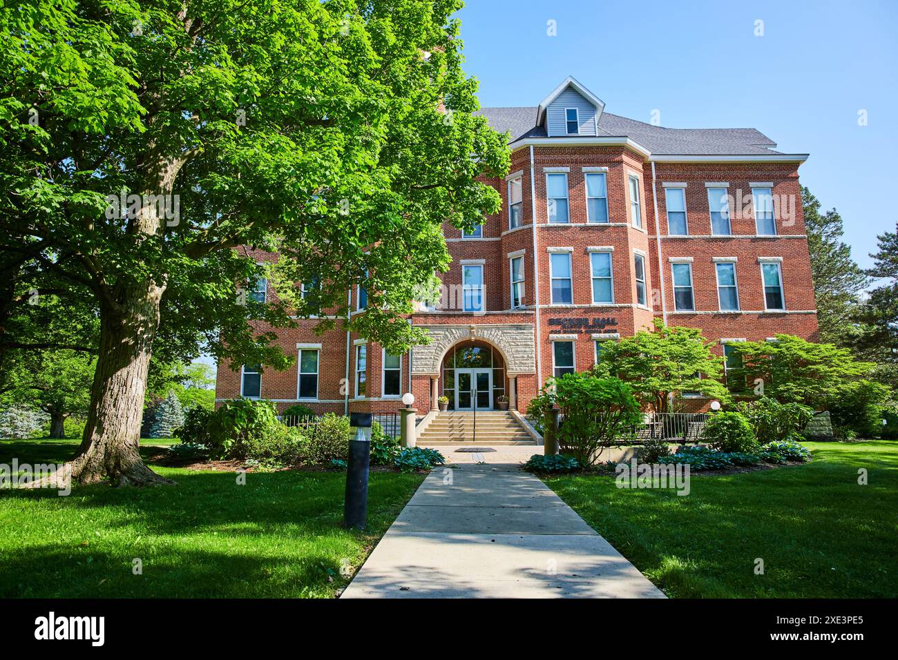Stately Red Brick Huntington Campus Building with Arched Entrance and ...