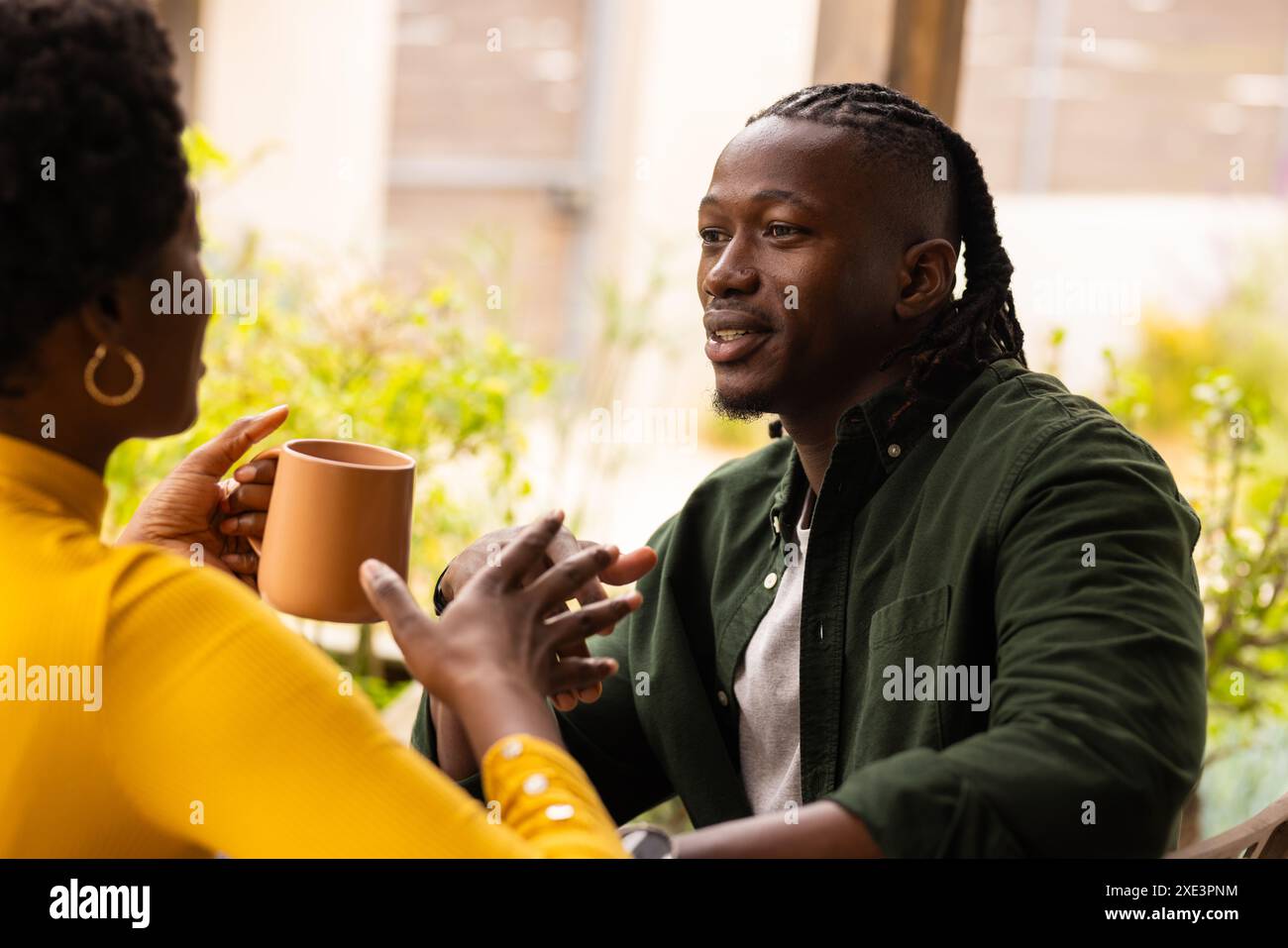 Outdoors, Couple enjoying coffee and conversation at home, bonding and ...