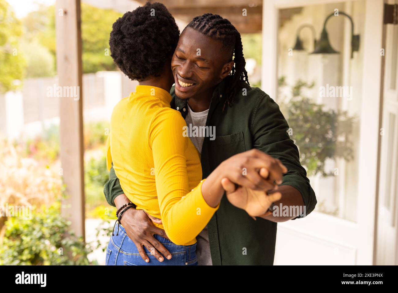Outdoors, Couple embracing and dancing together, enjoying quality time ...