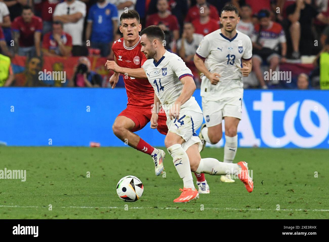 MUNICH, GERMANY - JUNE 25: Joakim Maehle of Denmark and Andrija ...