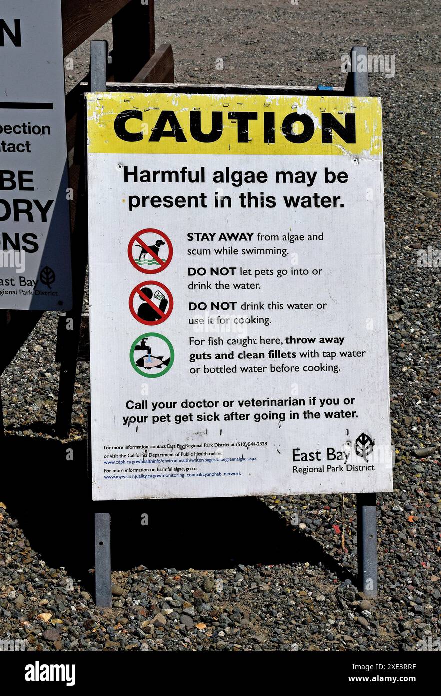 caution sign about toxic algae in water and advise at Quarry Lakes ...