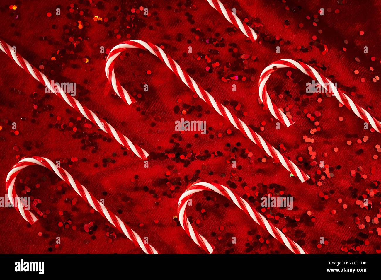 Christmas candy canes on burgundy velvet background Stock Photo - Alamy