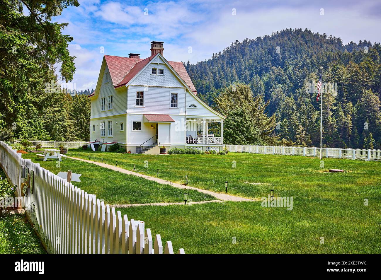 Classic American Home with Flag in Lush Mountain Setting from Ground ...