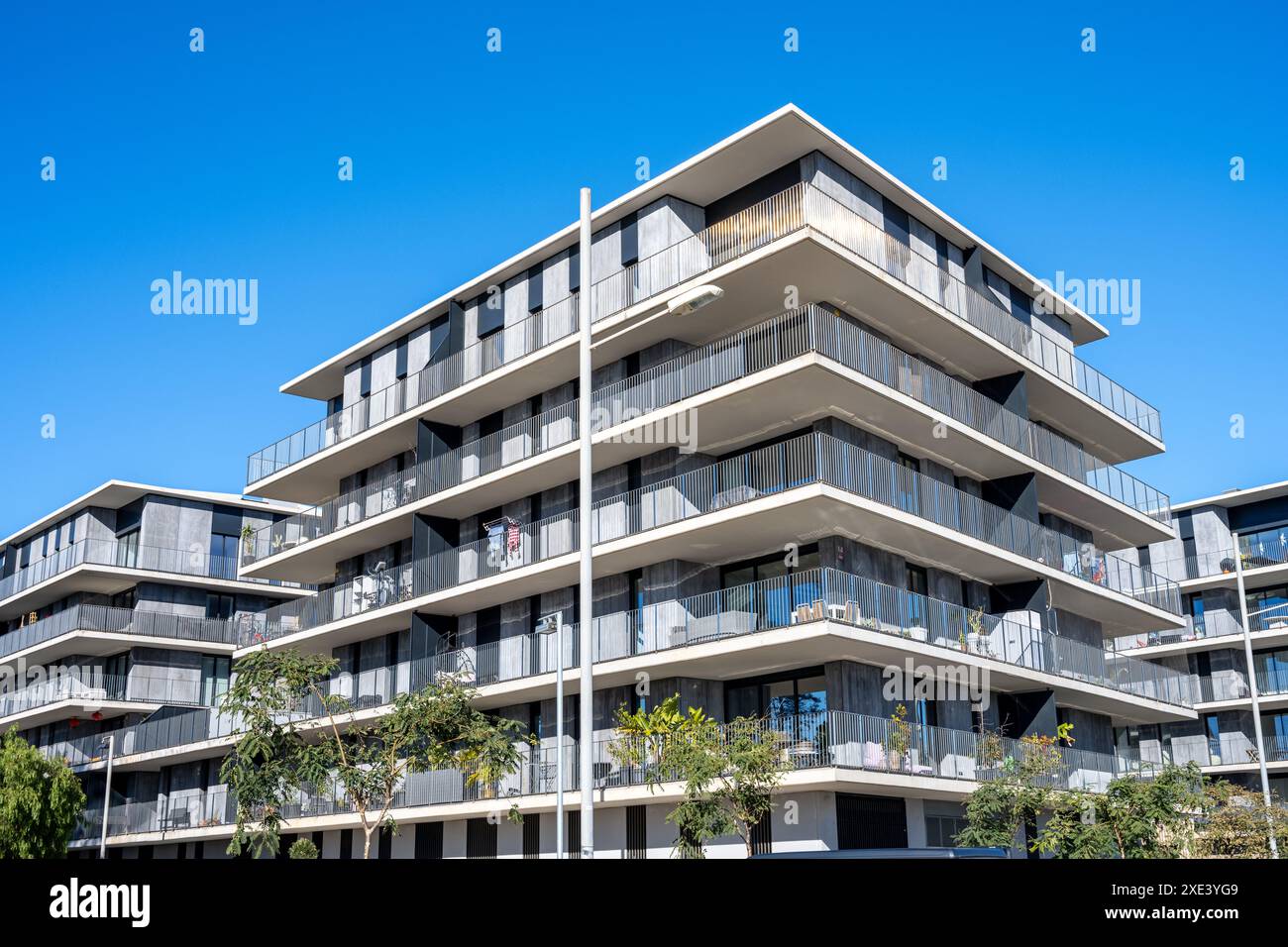 Modern gray apartment buildings with all-round balconies seen in ...
