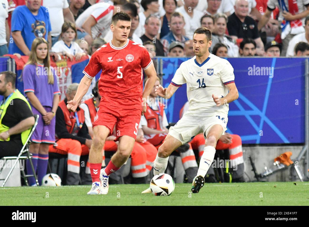 MUNICH, GERMANY - JUNE 25: Joakim Maehle of Denmark and Srdjan ...
