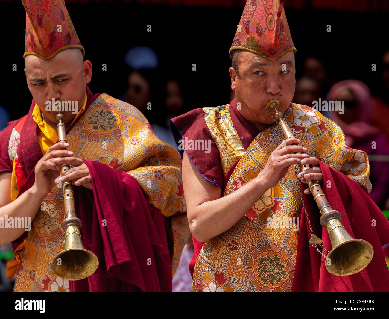 Ladakhi monks playing musical instrument wearing traditional costume ...