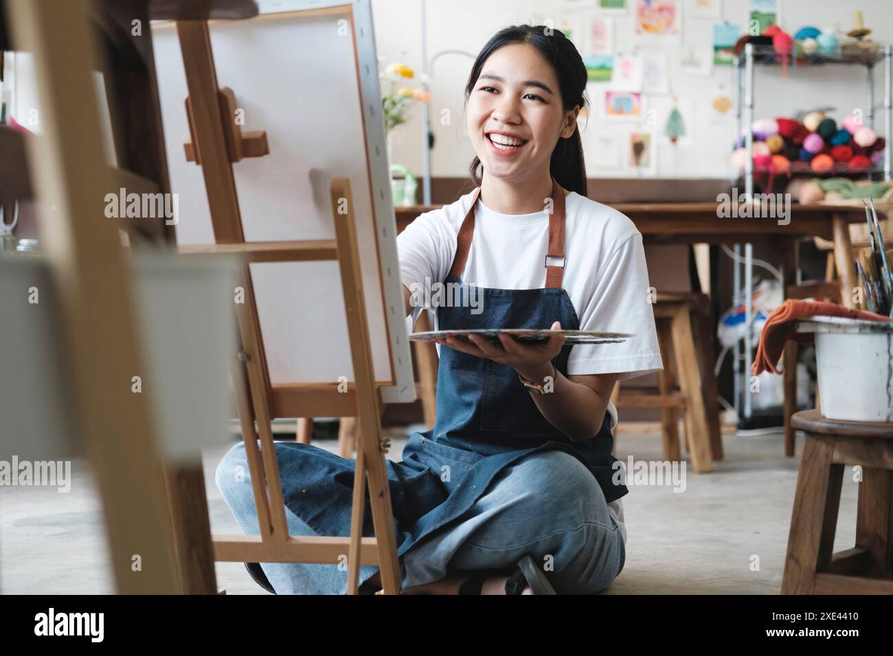 Crafting Inspiration. Female Artist Sketching and Painting in Workshop ...