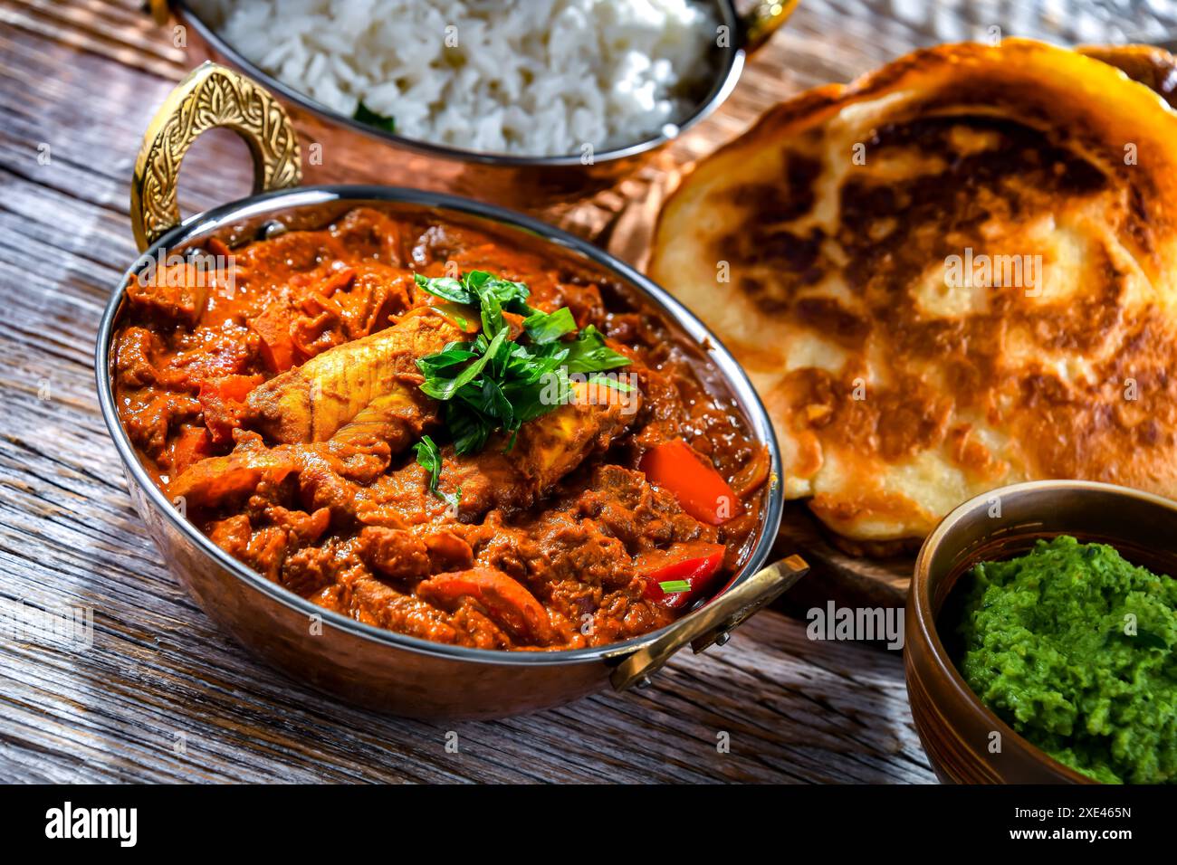 Butter chicken with rice and naan flatbread served in original indian ...