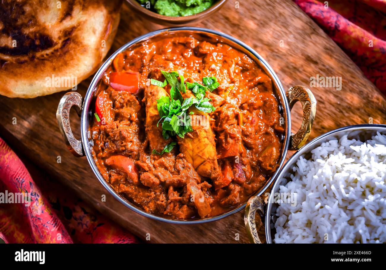 Butter chicken with rice and naan flatbread served in original indian ...