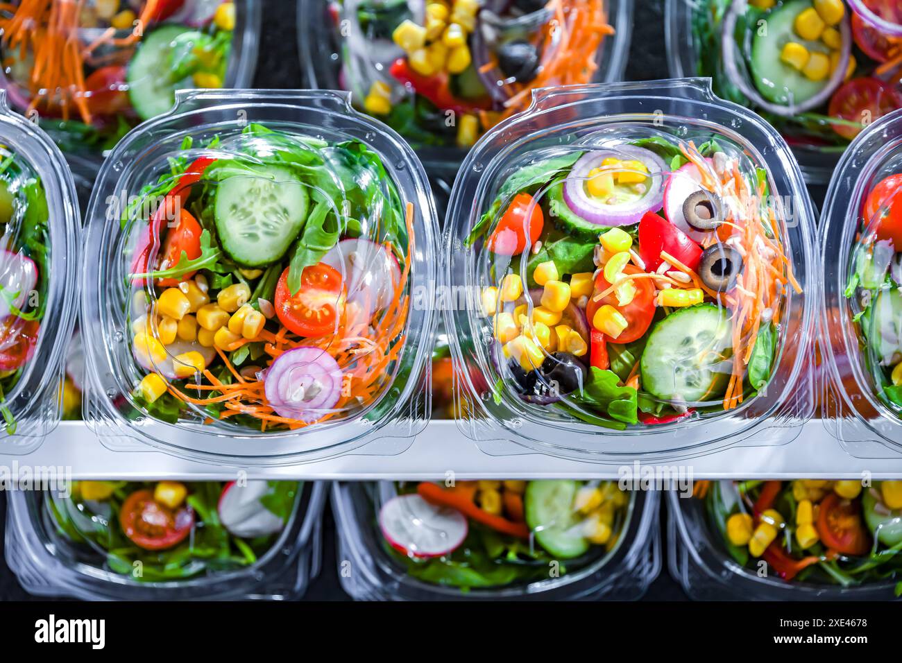 Plastic boxes with pre-packaged vegetable salads Stock Photo - Alamy