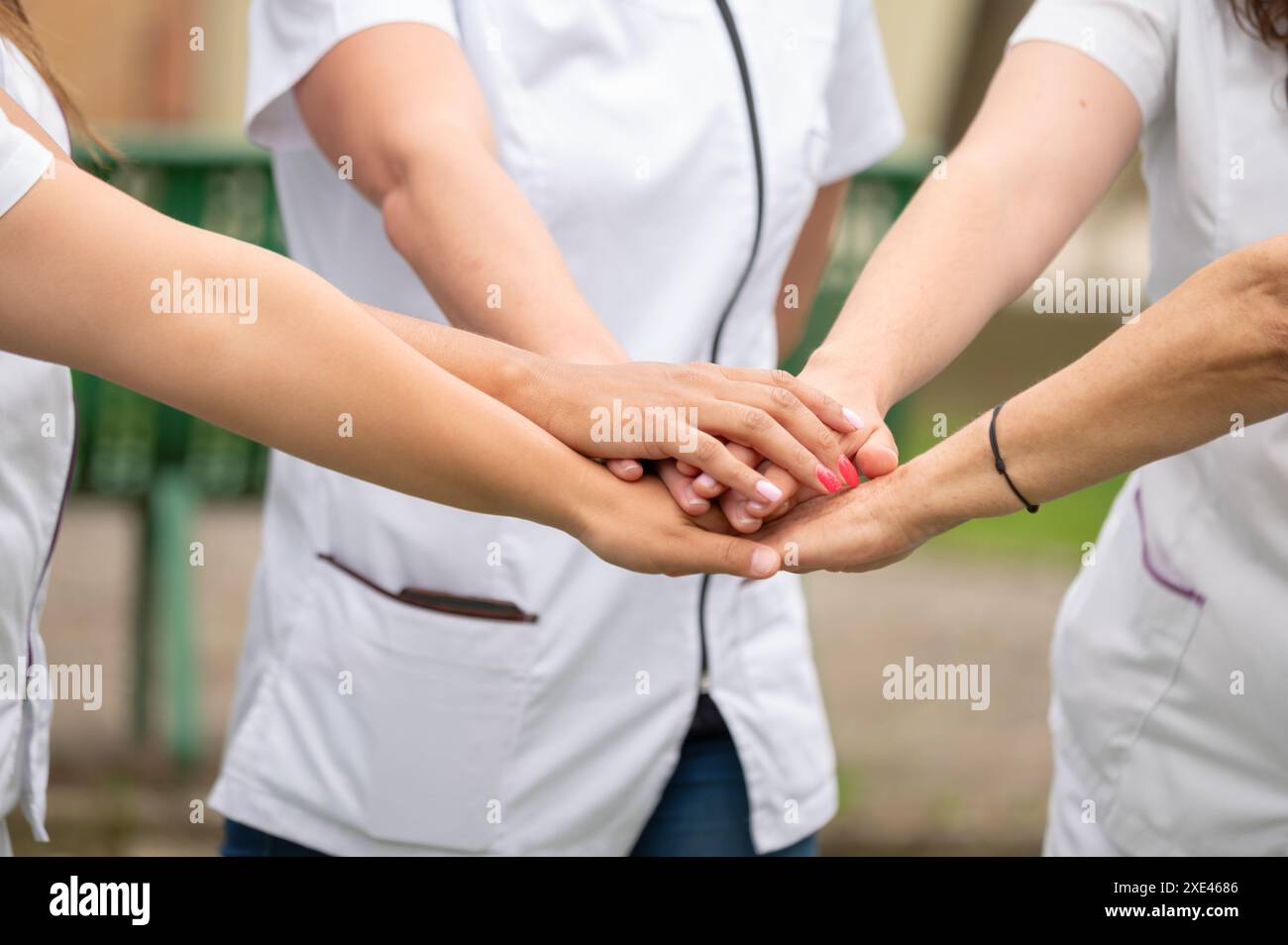 Close up image of nurses stacking hands and expressing support Stock ...