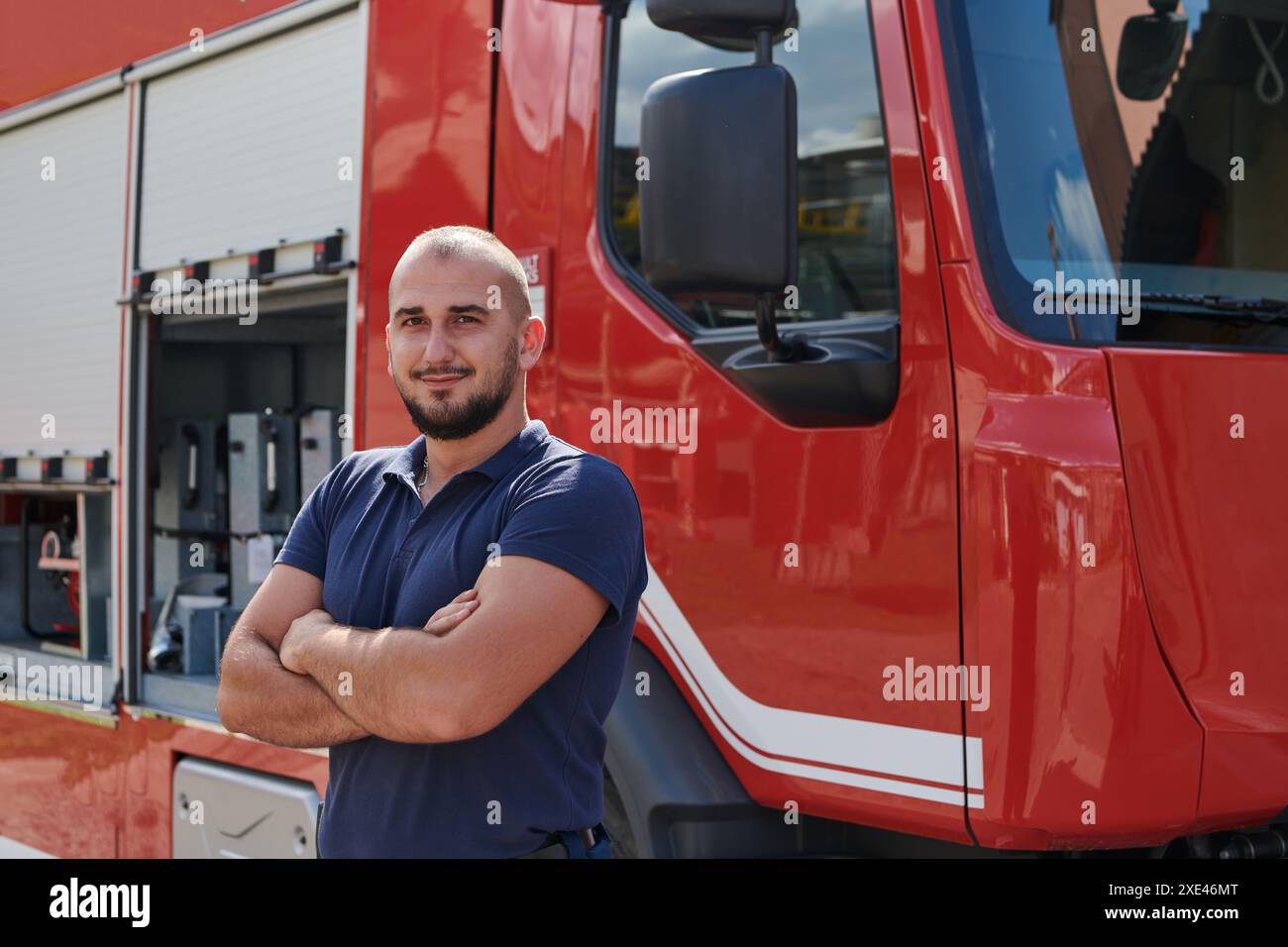 Confident firefighter stands with crossed arms, exuding resilience and ...