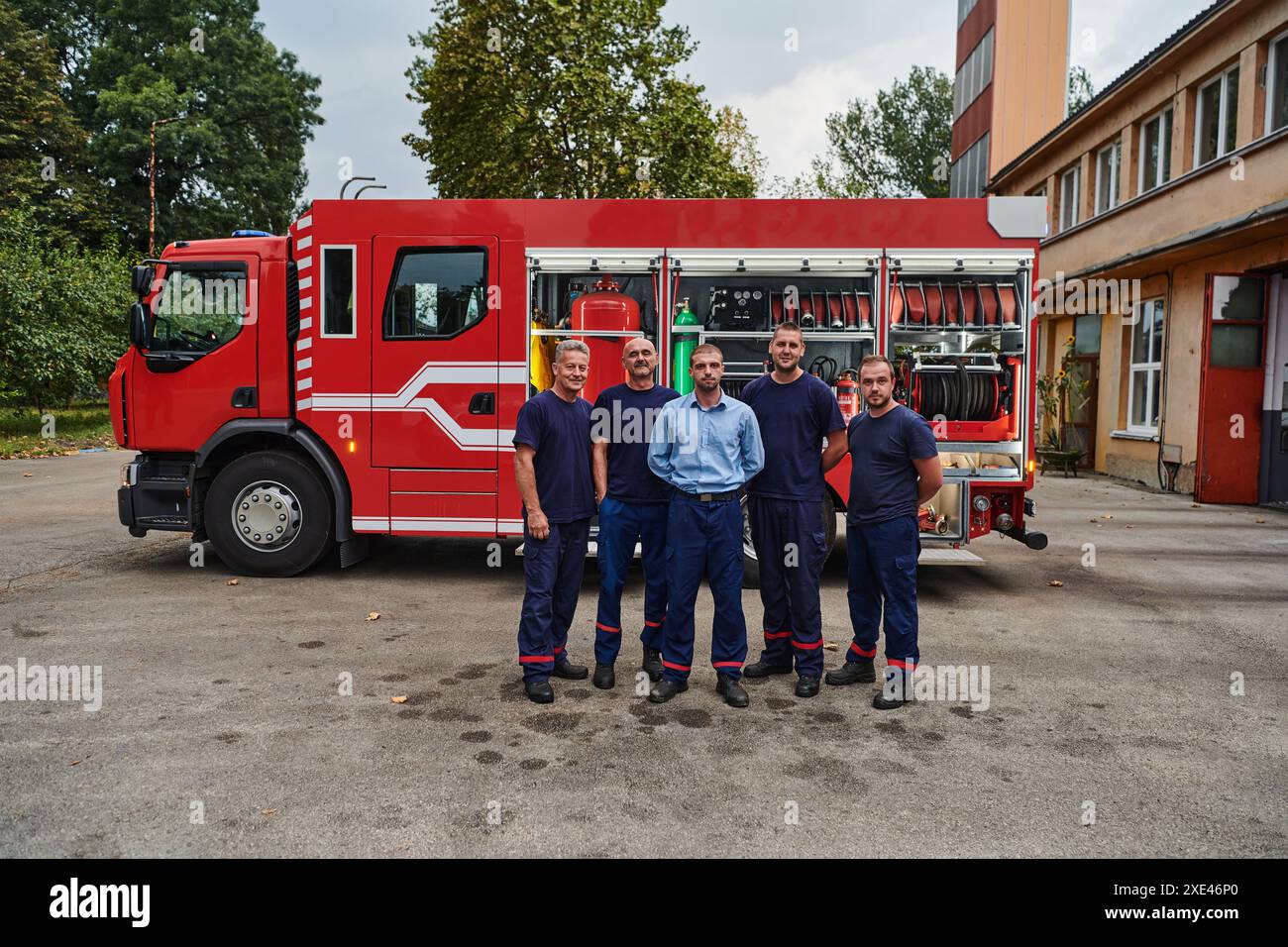 A skilled and dedicated professional firefighting team proudly poses in ...