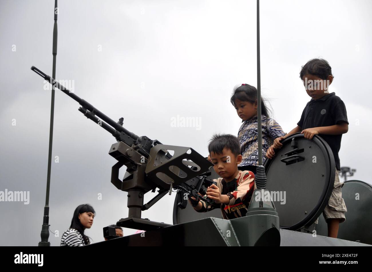 Jakarta, Indonesia - December 13, 2014 : Children try out combat ...