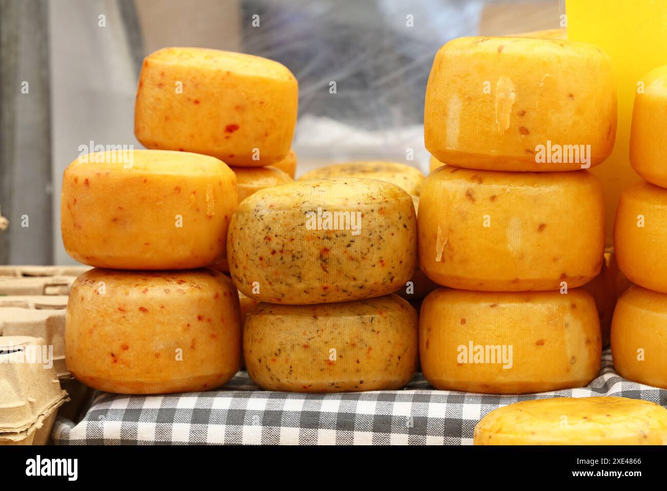 Small heads of hard cheese on retail display Stock Photo - Alamy