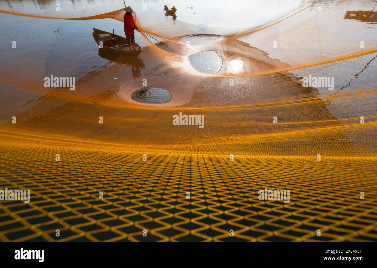 Hoi An, Central Vietnam. 26th June 2024. Local fisherman catching fish ...