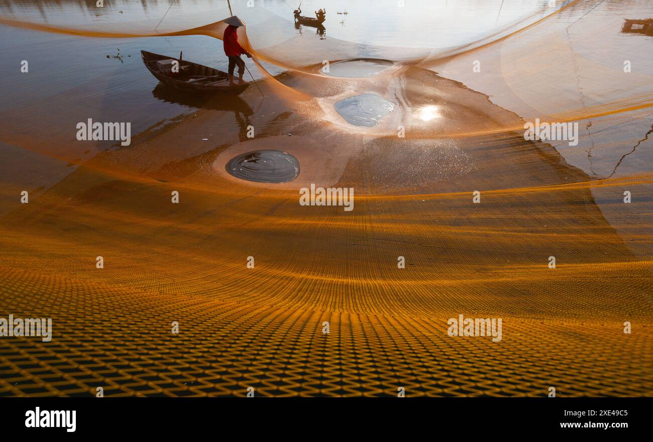 Hoi An, Central Vietnam. 26th June 2024. Local fisherman catching fish ...