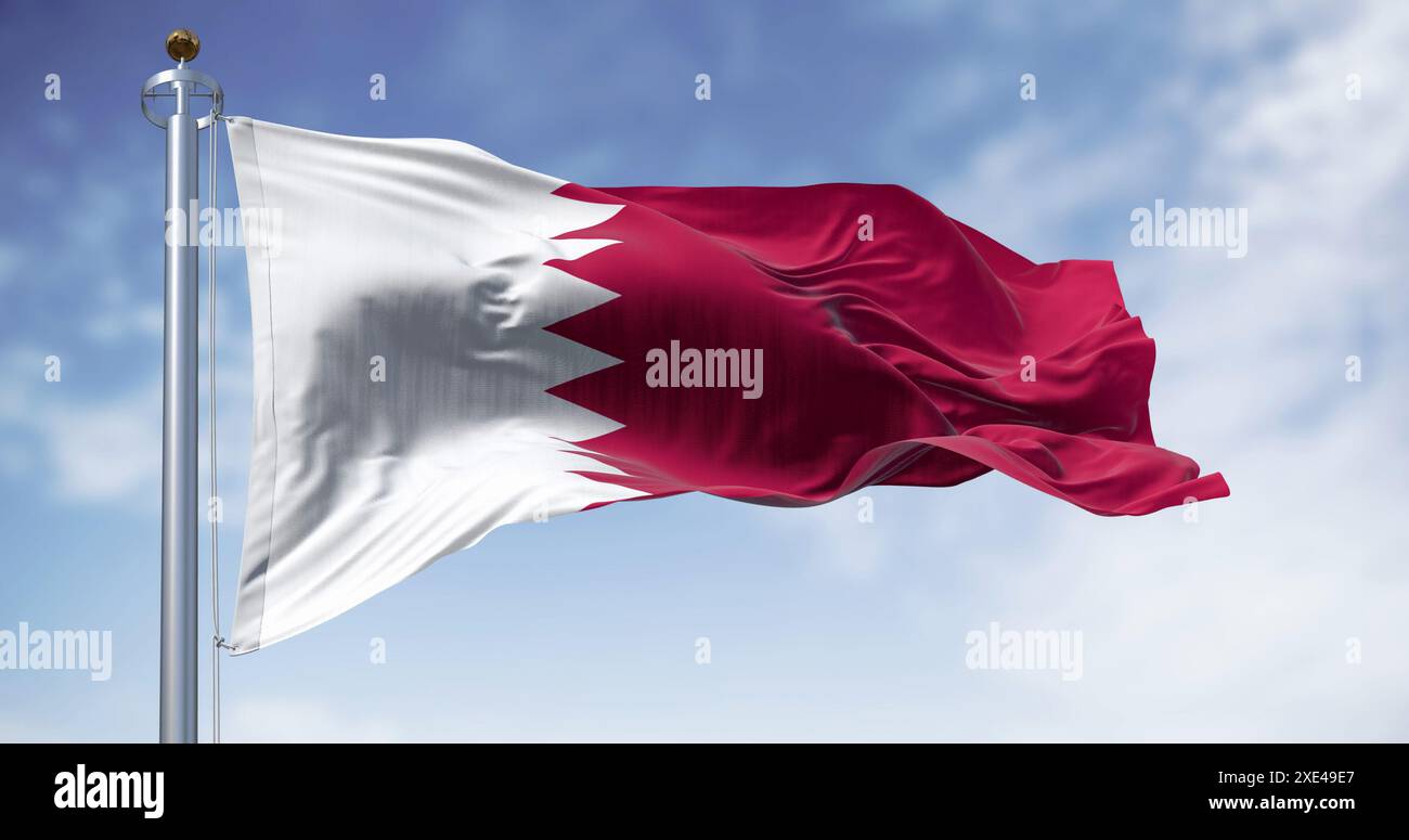 Qatar national flag waving in the wind on a clear day Stock Photo - Alamy