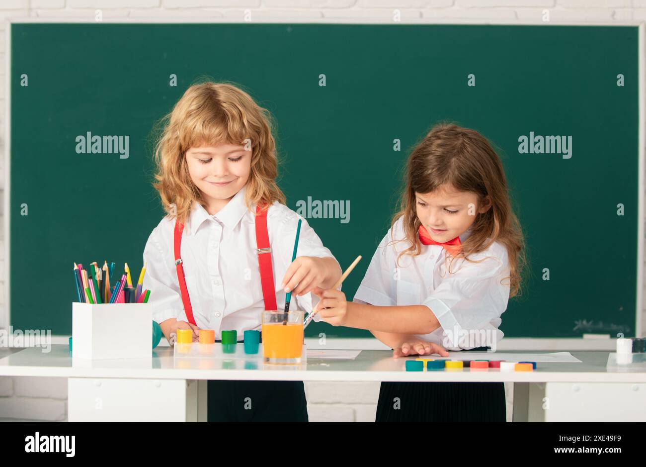 Portrait school kids doing art homework. Children drawing on school ...