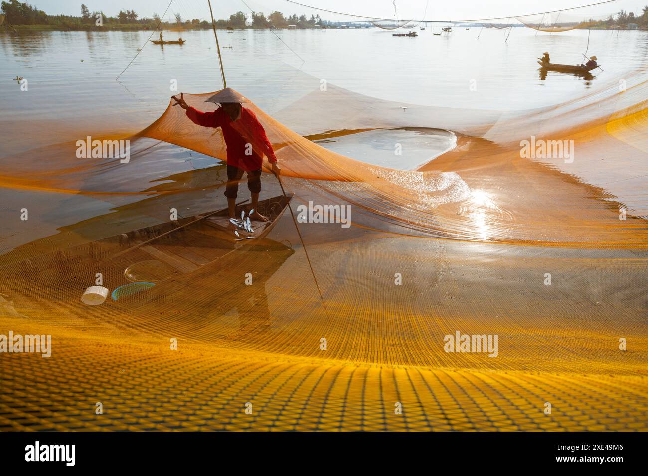 Hoi An, Central Vietnam. 26th June 2024. Local fisherman catching fish ...