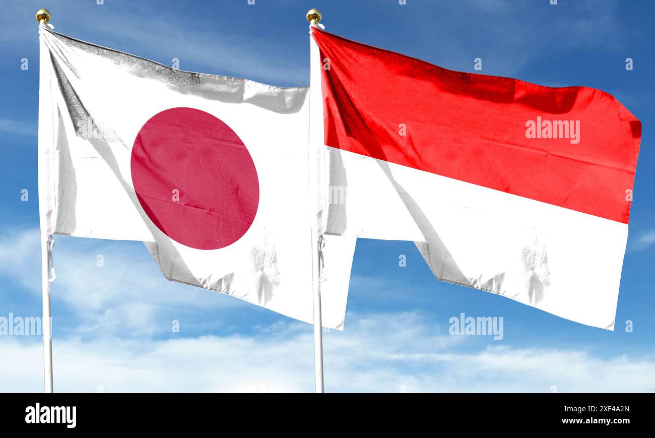 Japan flag and Indonesia flag on cloudy sky. waving in the sky Stock ...