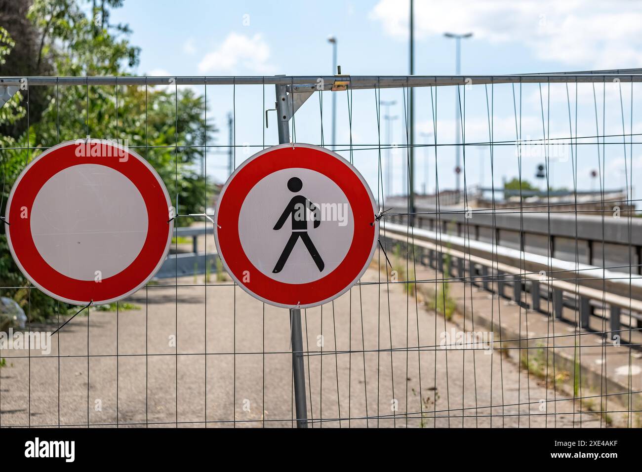 Two prohibition signs for pedestrians in front of a construction site ...