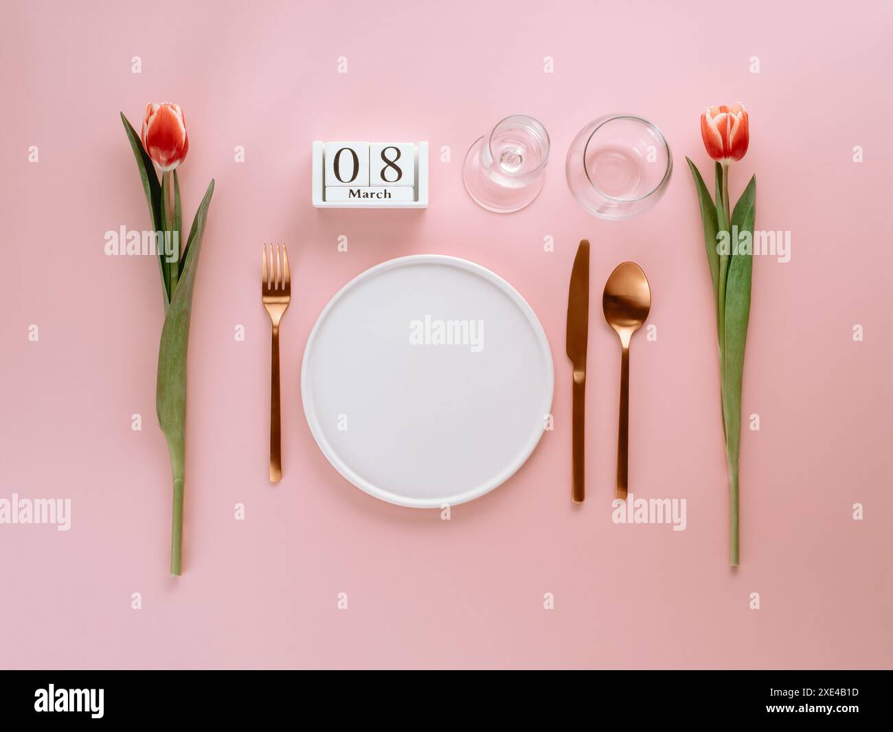 8 march table setting. Empty white plate, calendar with march eight ...