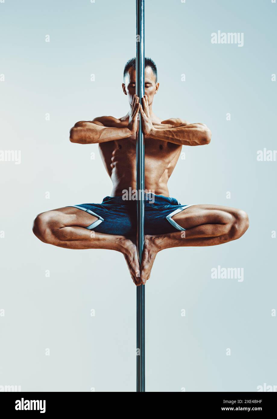 Pole dancing man Stock Photo - Alamy