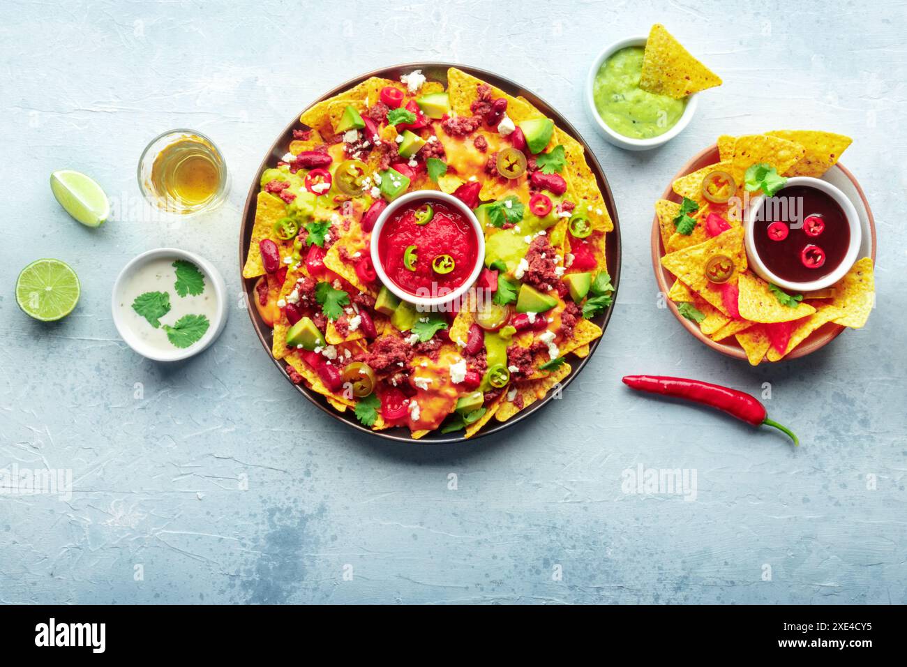 Loaded nachos. Mexican nacho chips with beef, overhead flat lay shot ...