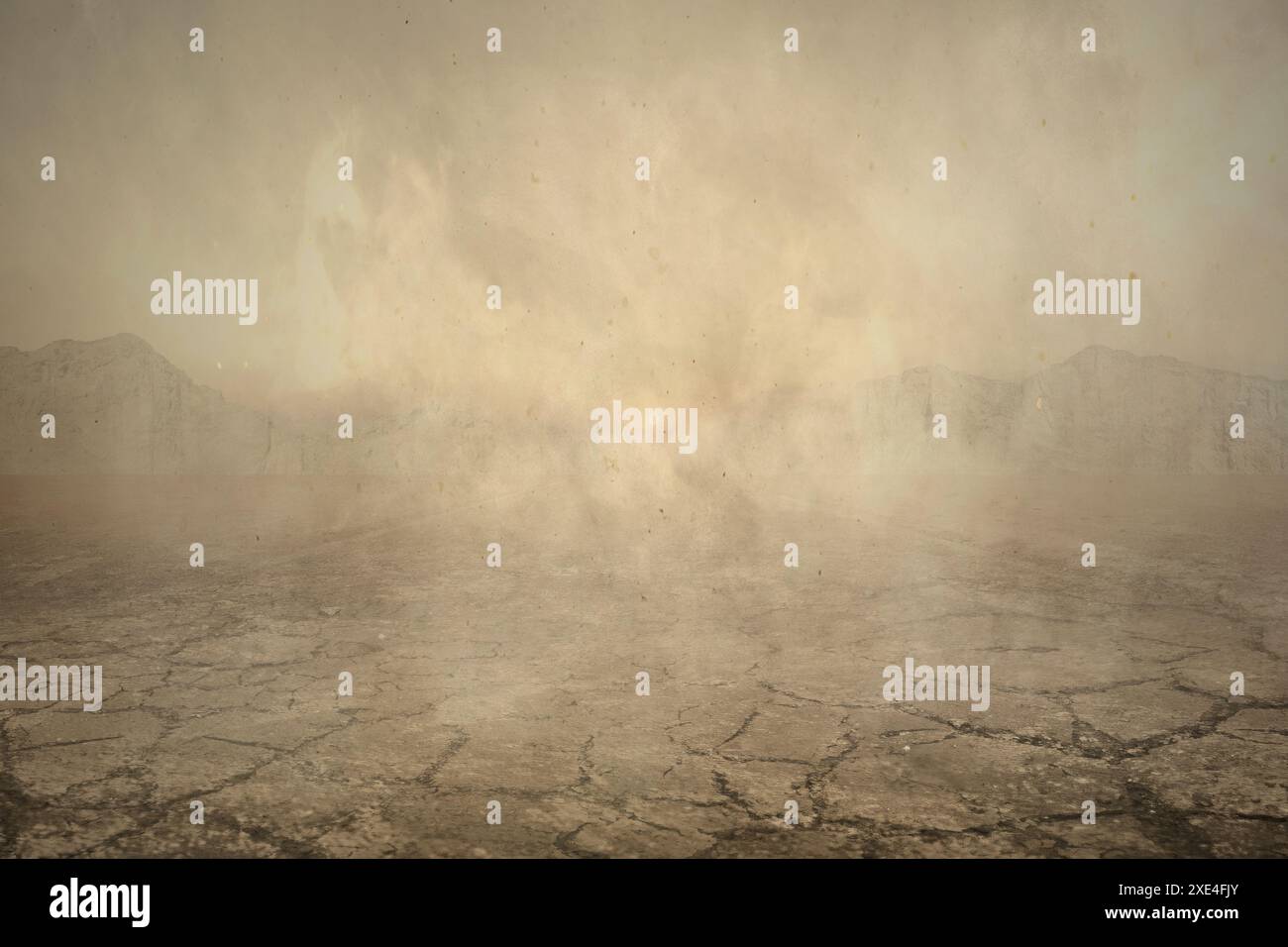 Powerful dust devil forms in a barren landscape with mountains in the ...