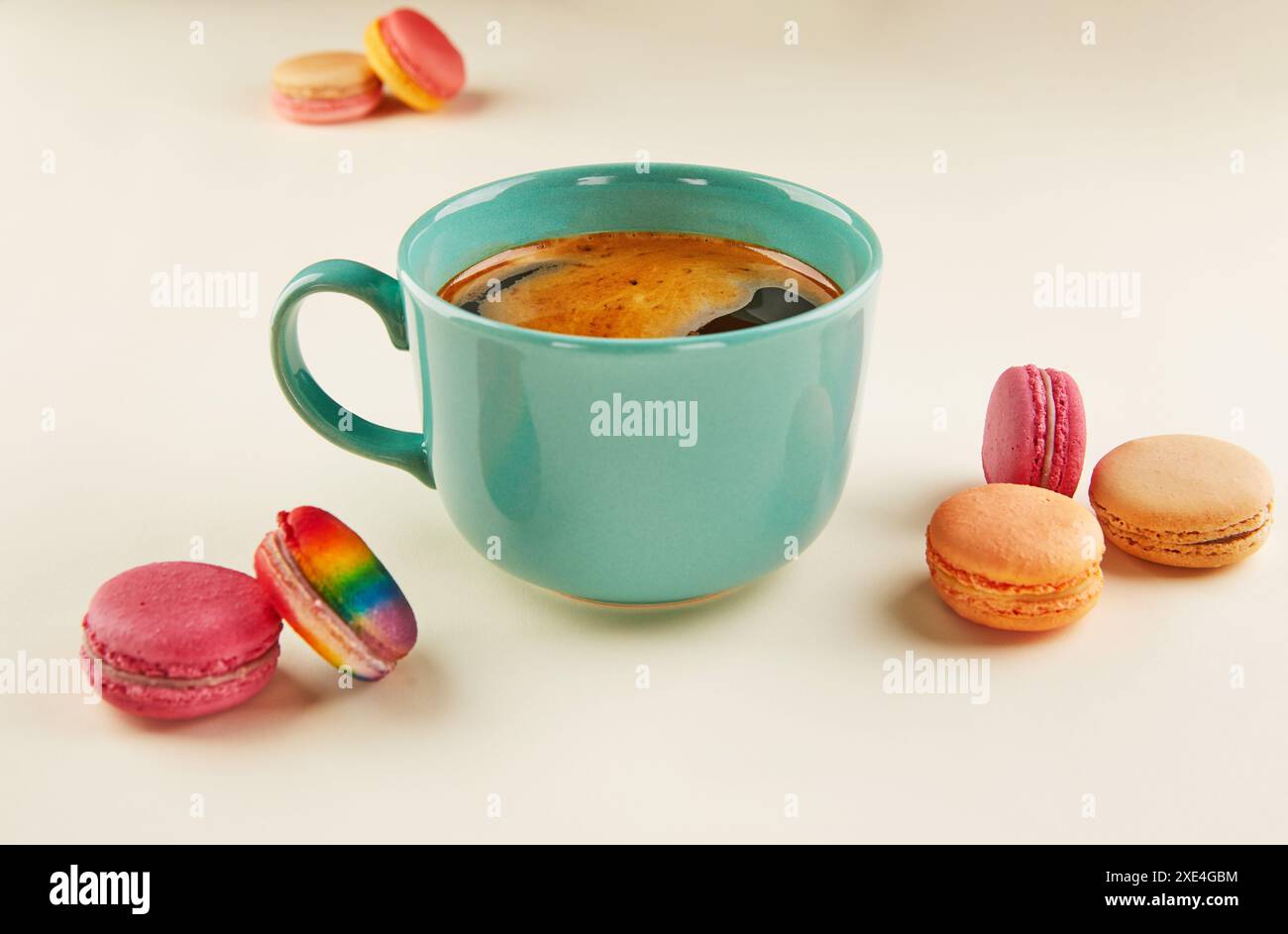 Multi-colored macaroons of different colors and flavors on a beige ...