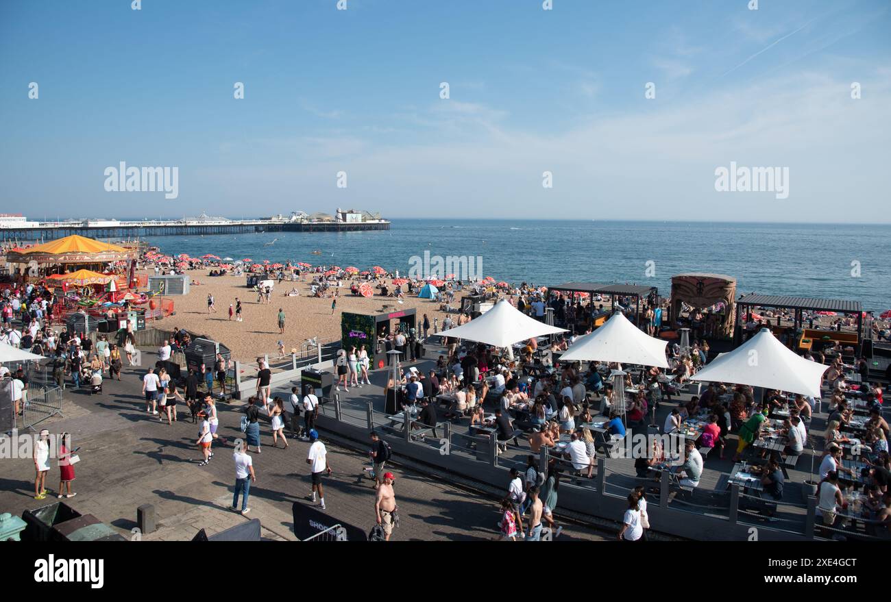 Crowd of british people walking and having fun at brighton town ...
