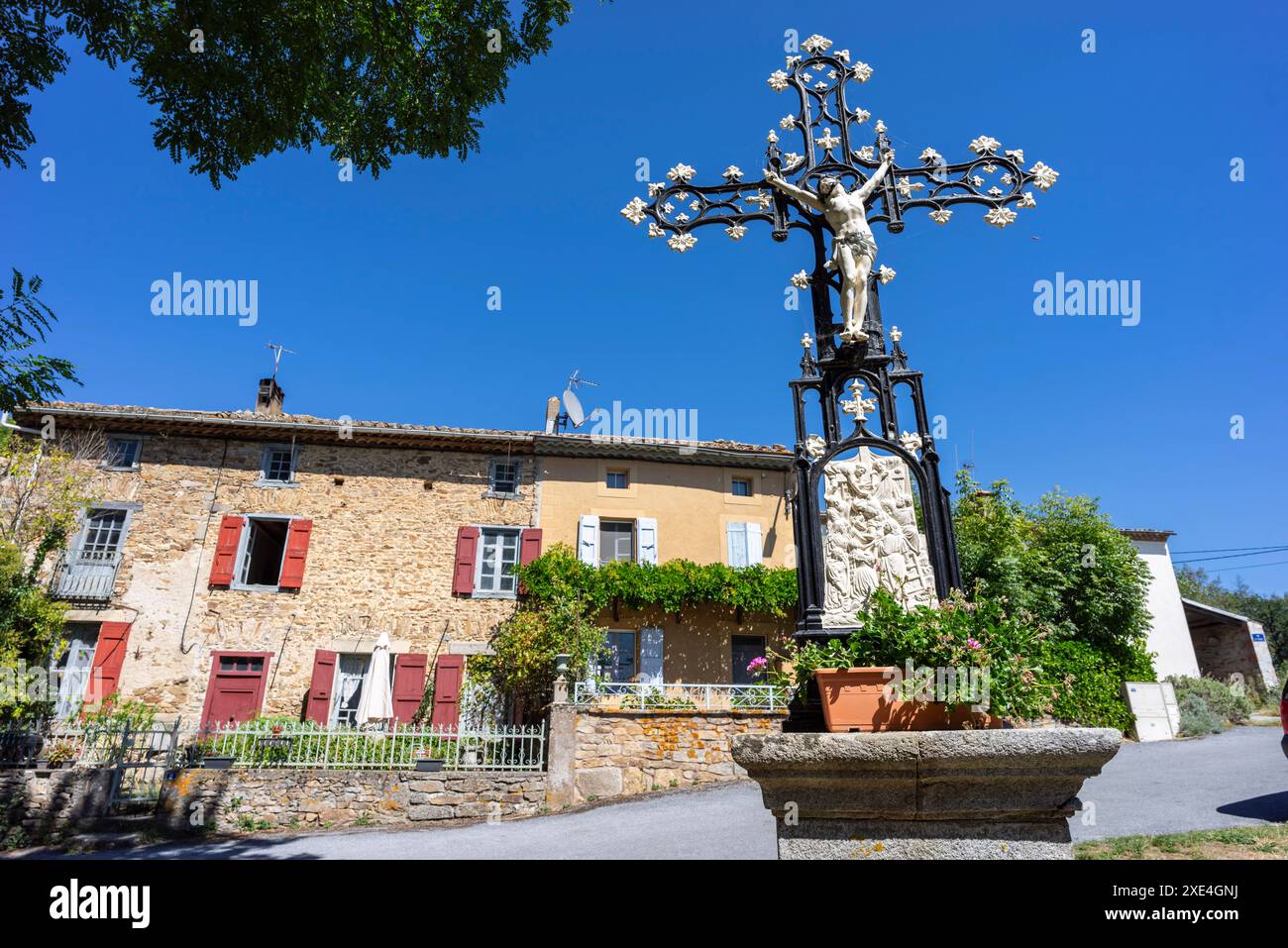 Typical house and decorated cross Stock Photo - Alamy