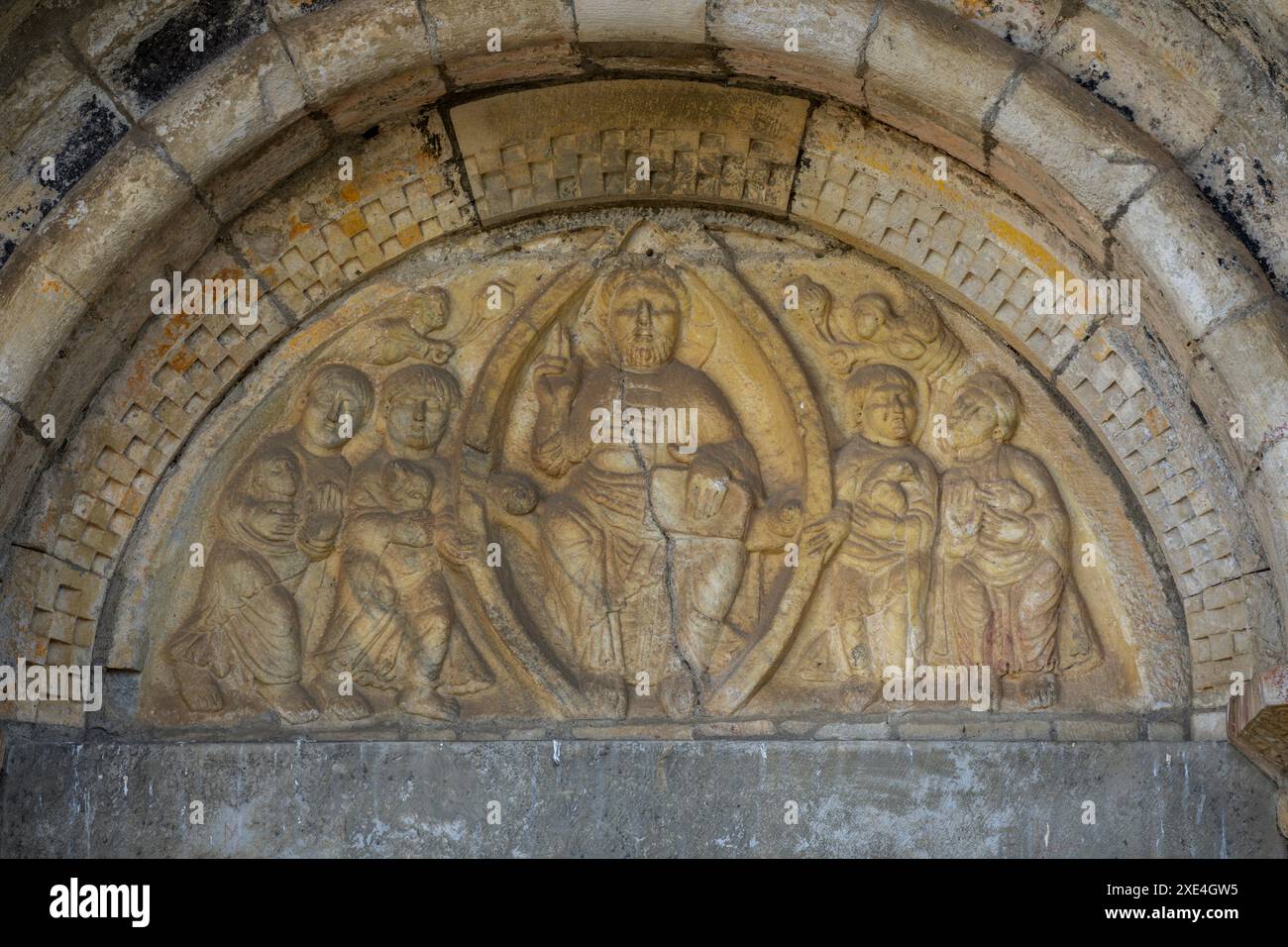 Tympanum with effigy of Christ in Majesty in his mandorla and the four ...