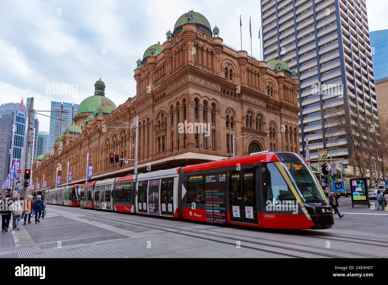 A light rail vehicle speeds past Sydney's historic Department of Lands ...