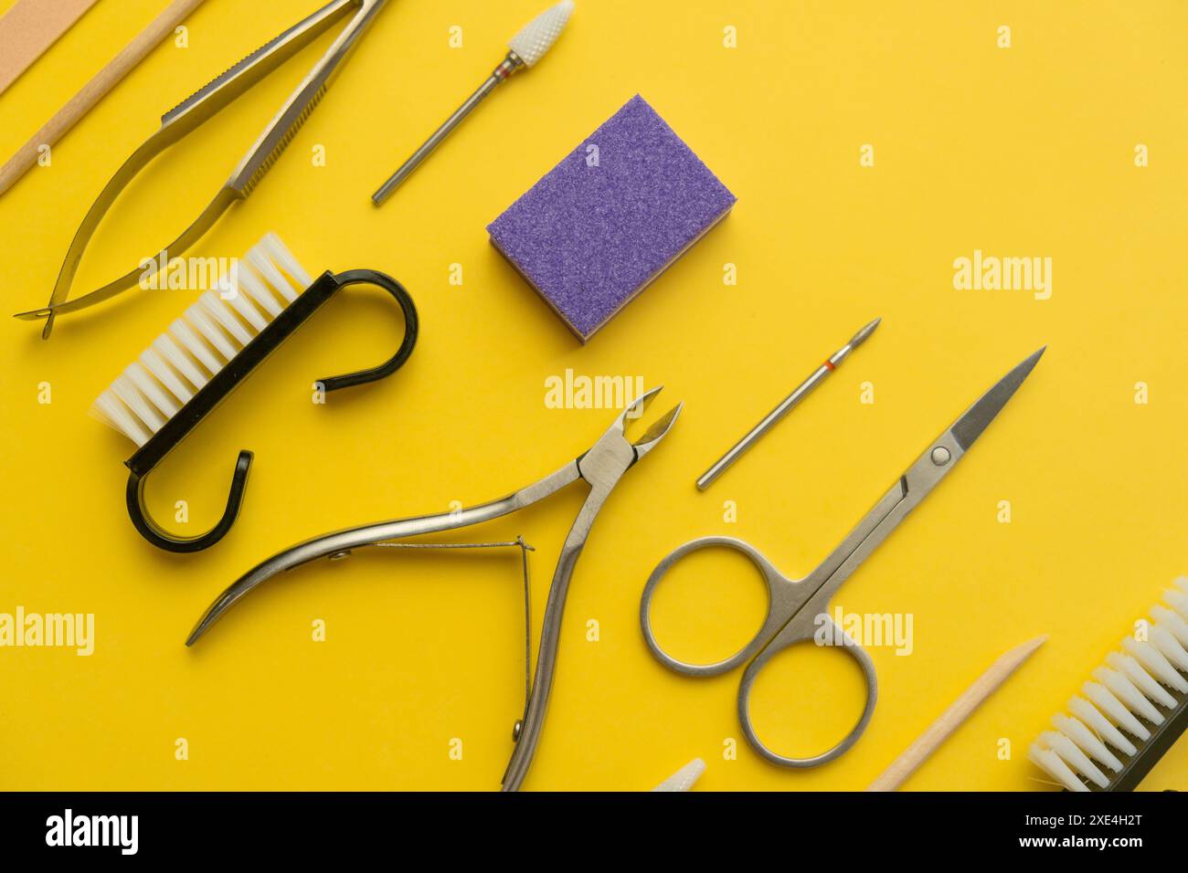 Professional manicure tools on yellow background. Manicure set Stock ...