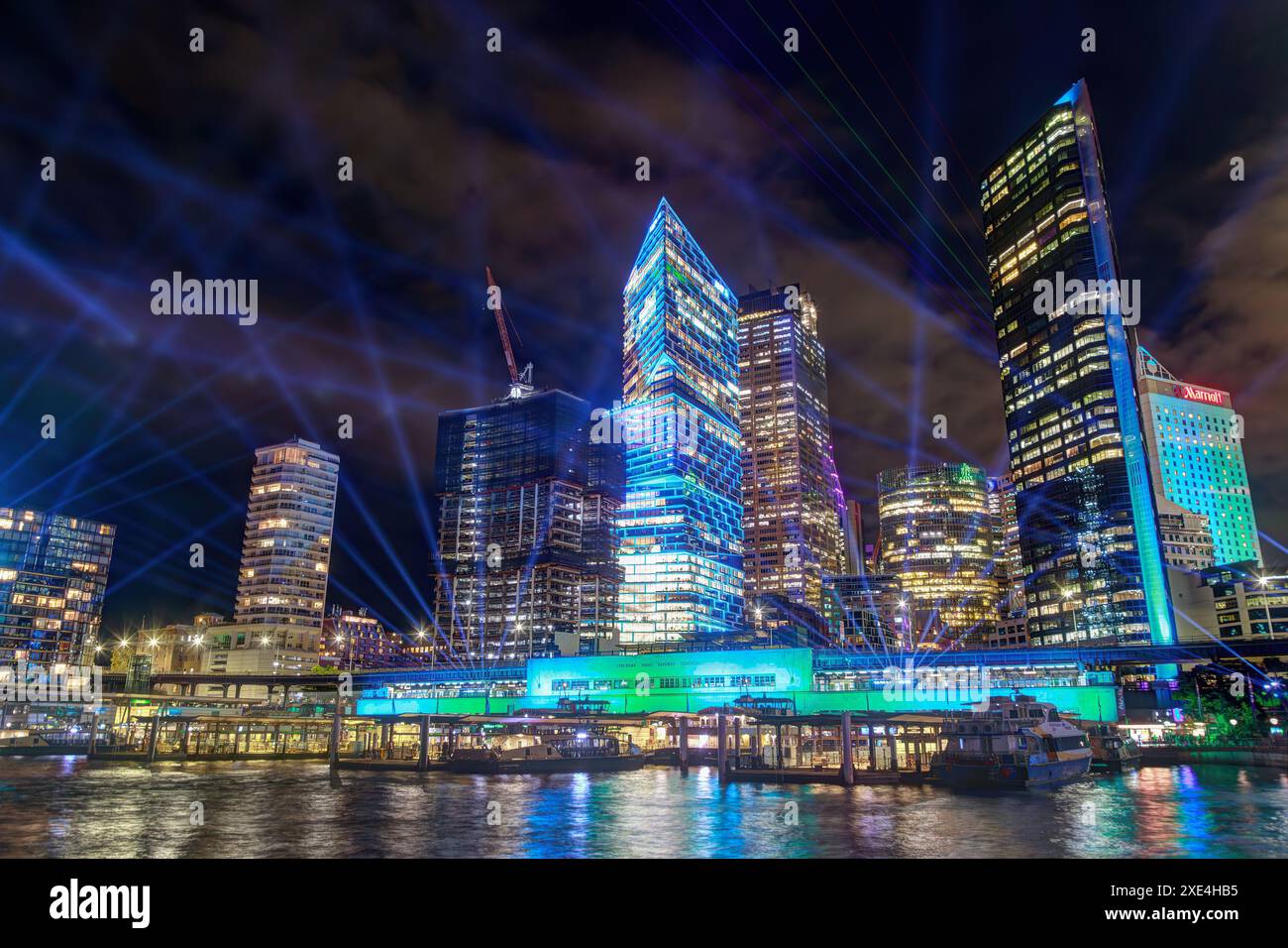 The buildings of central Sydney, Australia, illuminated with colorful ...