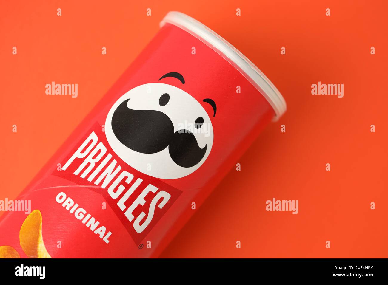 KYIV, UKRAINE - APRIL 20, 2024 Pringles original potato chips on red ...