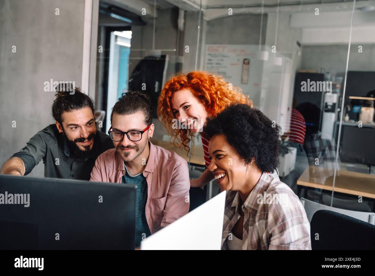Mixed team of software engineers brainstorming ideas. Diverse app developers collaborating as ...