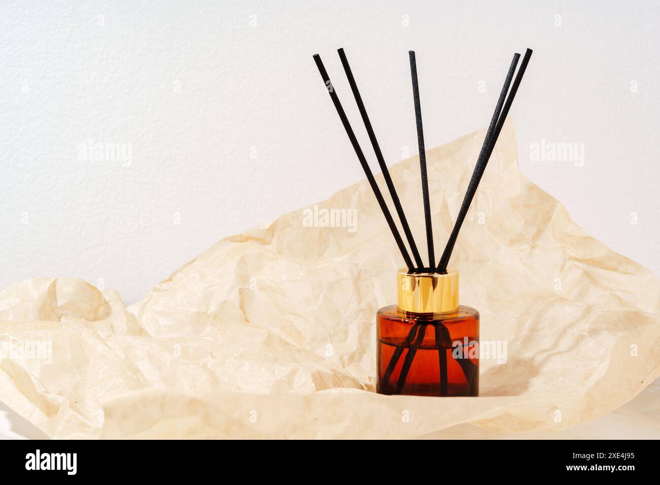 Brown Glass Reed Diffuser on Crumpled Paper Stock Photo - Alamy